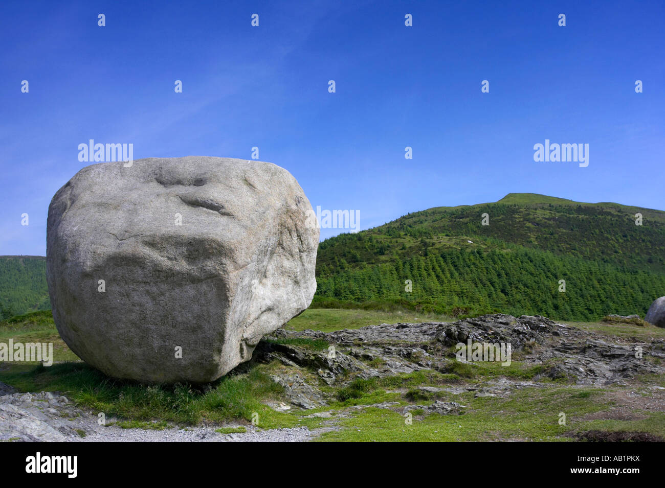 The cloughmore stone looking up towards Slieve Martin and bright blue ...