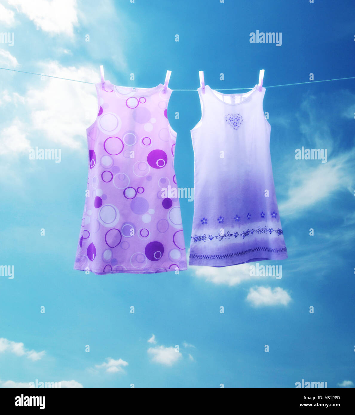 two dresses on a washing line Stock Photo - Alamy