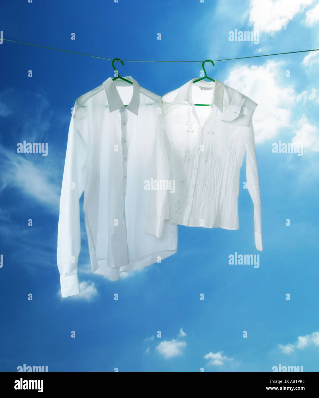 two white shirts on a washing line Stock Photo - Alamy