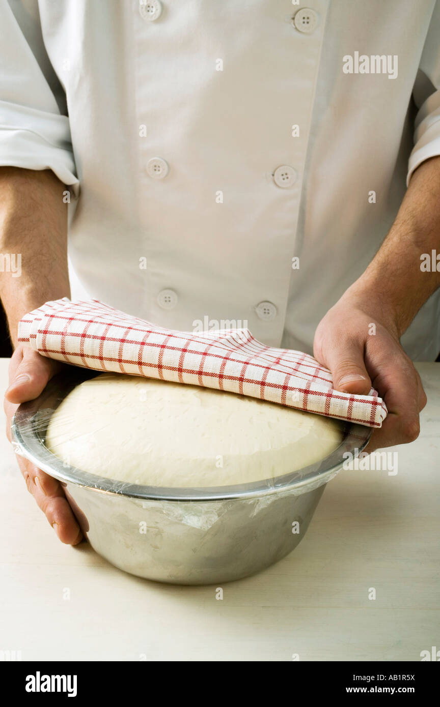 Leaving pizza dough to rest in a bowl FoodCollection Stock Photo - Alamy