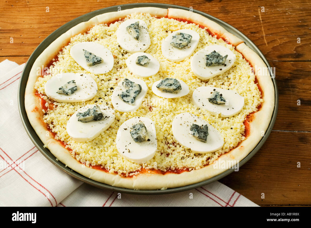 Three cheese pizza unbaked FoodCollection Stock Photo - Alamy