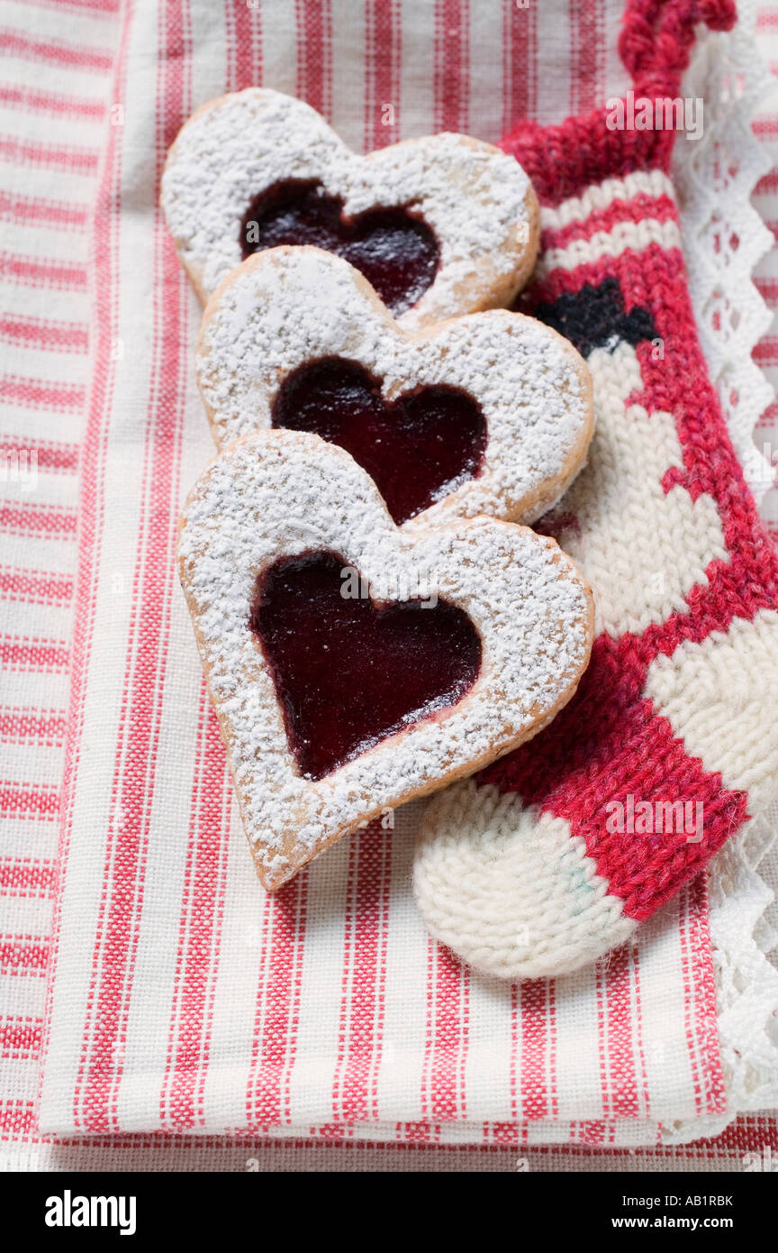Heart shaped biscuits with raspberry jam and icing sugar FoodCollection ...