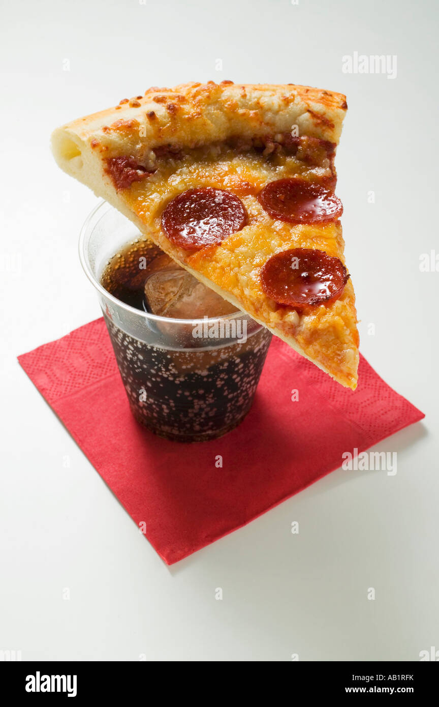 Slice of American style pepperoni pizza on cola FoodCollection Stock ...