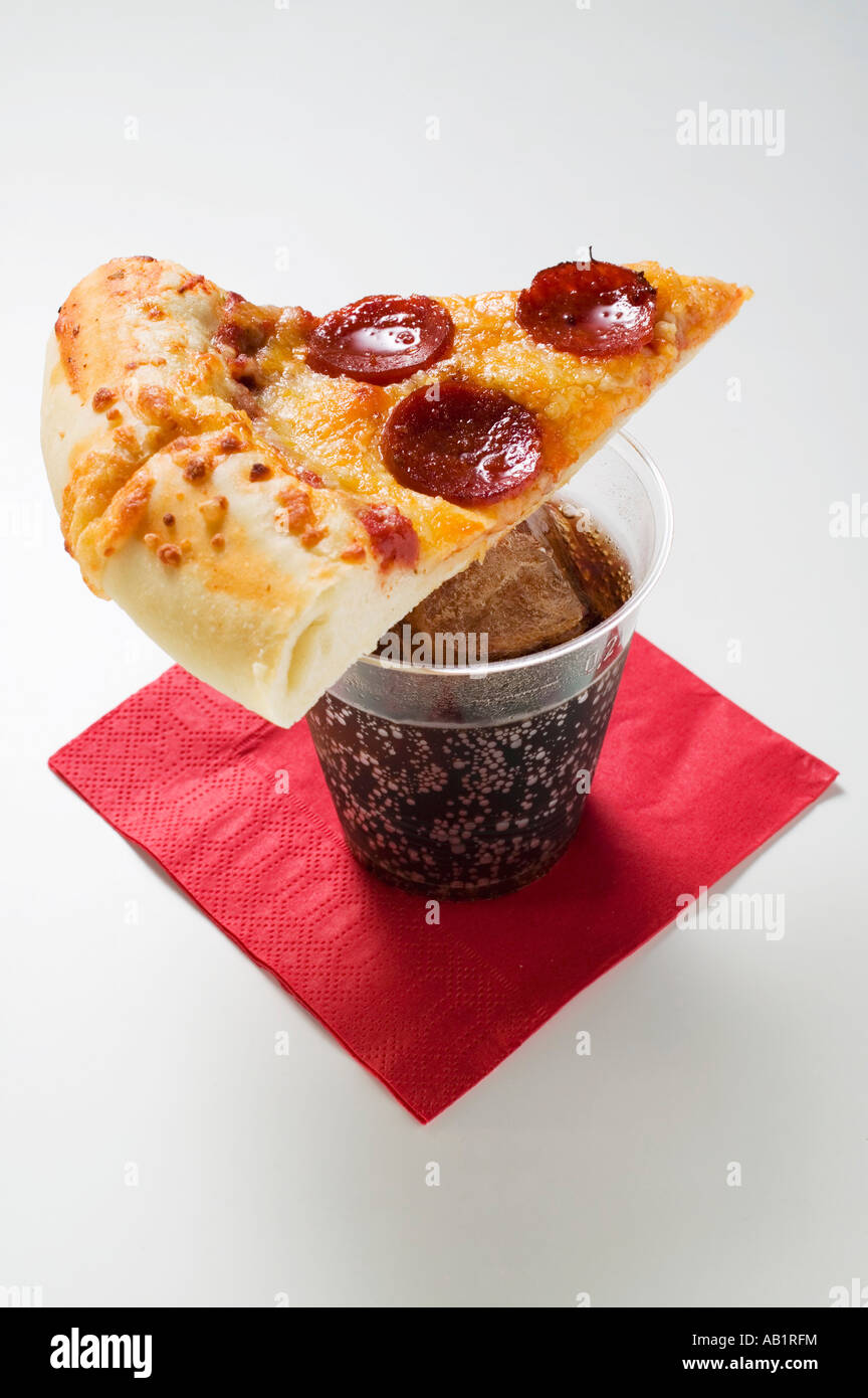 Slice of American style pepperoni pizza on cola FoodCollection Stock ...