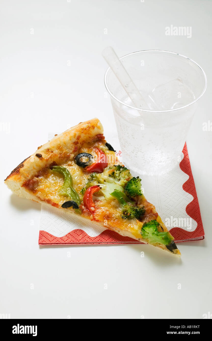 Slice of American style vegetable pizza and mineral water ...