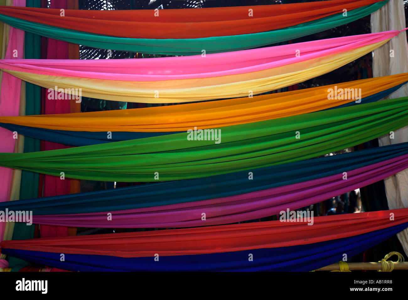 Coloured hammocks display long running weekly Anjuna Flea Market Goa ...