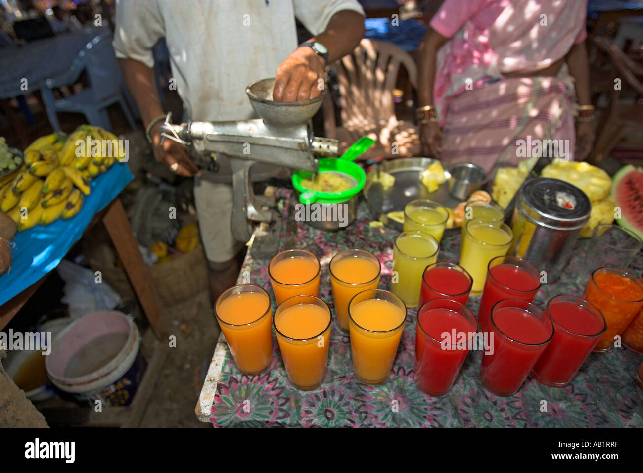 Making fresh fruit juices with an old style juicer long running weekly ...