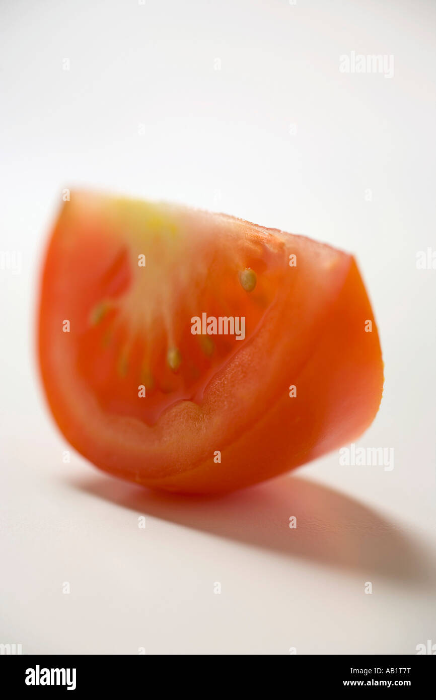 A tomato wedge FoodCollection Stock Photo - Alamy