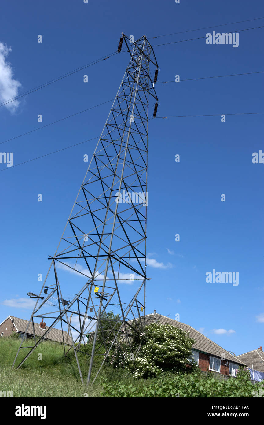 ELECTRICITY PYLON AND CABLES NEAR TO HOUSE Stock Photo - Alamy