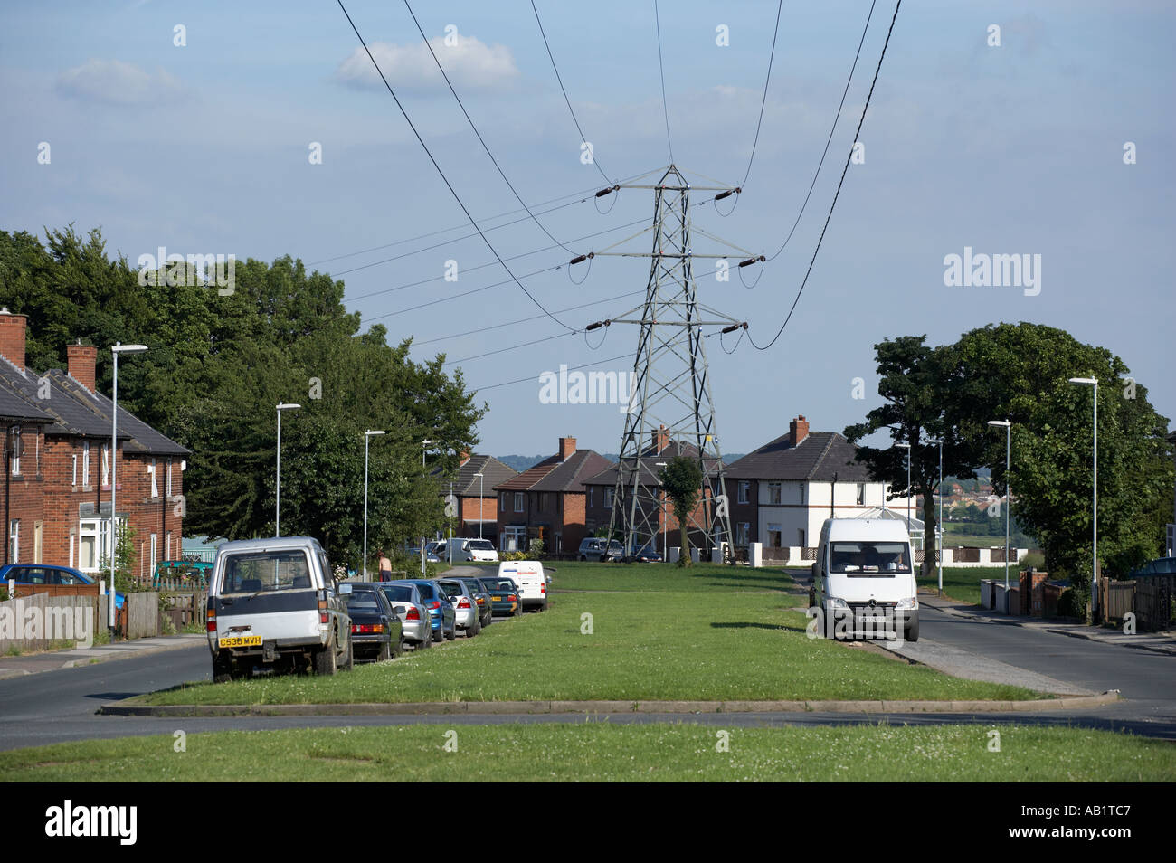 ELECTRICITY PYLON AND CABLES NEAR TO HOUSE Stock Photo - Alamy