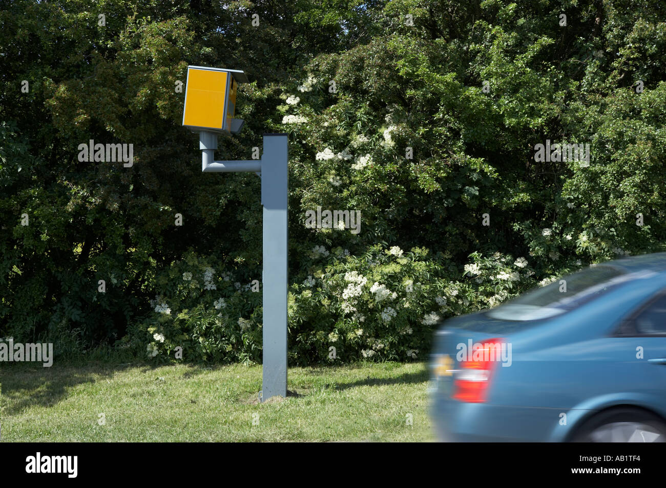 YELLOW GATSO ROAD SAFETY SPEED CAMERA WITH MOVING CAR Stock Photo - Alamy
