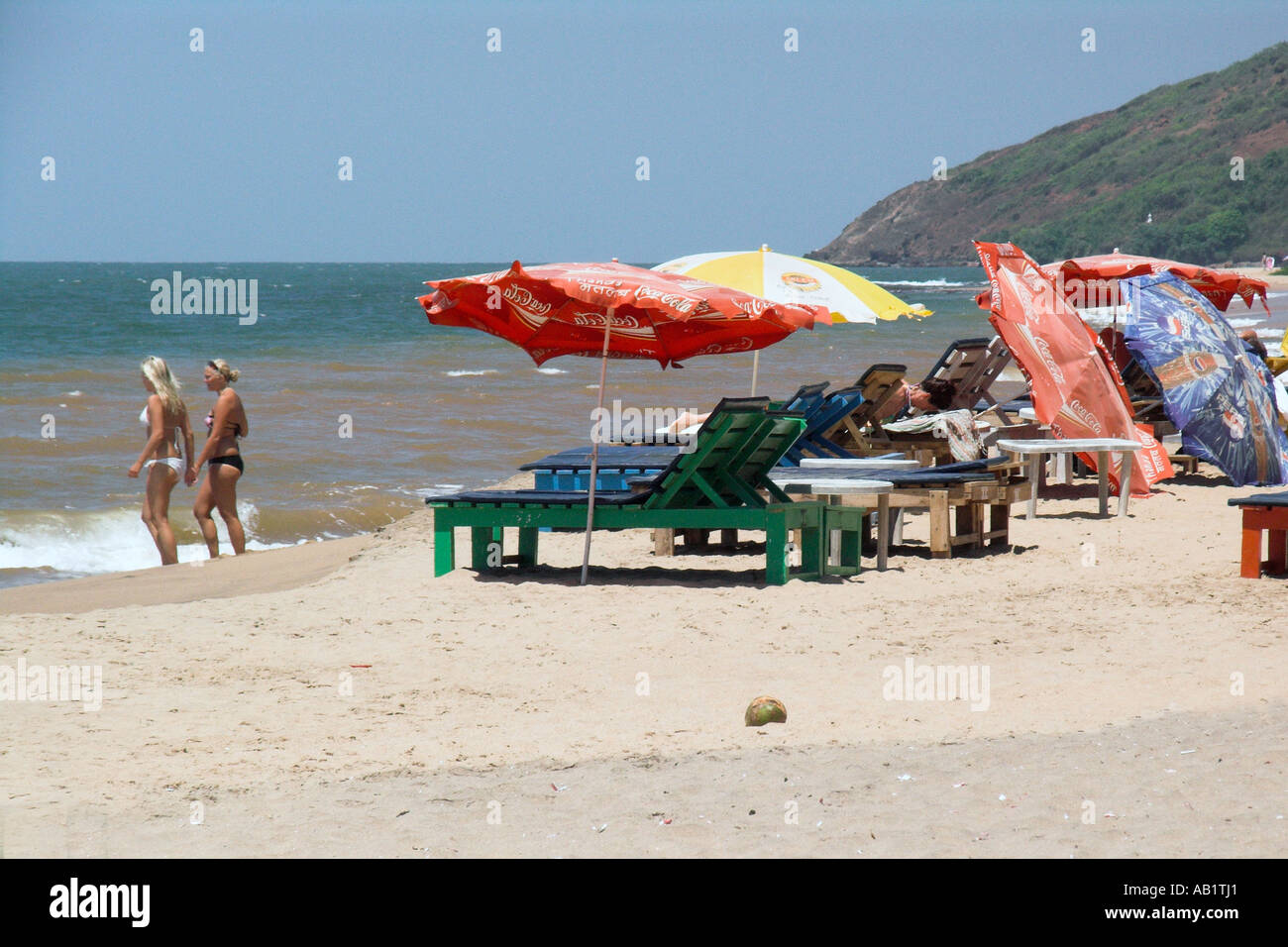Two bikini women cool off at Anjuna Beach Goa India Stock Photo - Alamy