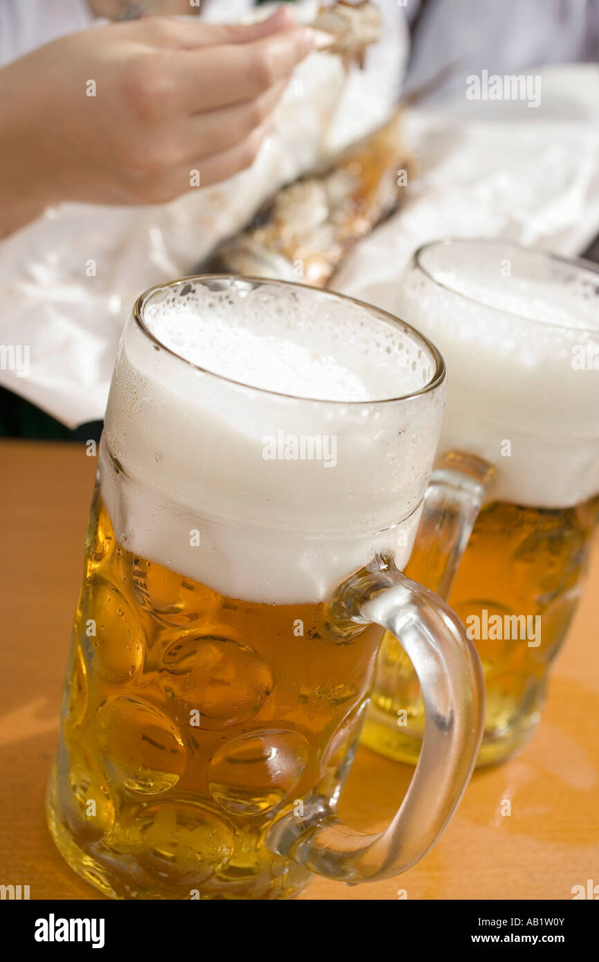 Litres of beer Steckerlfisch fish on stick Oktoberfest Munich ...