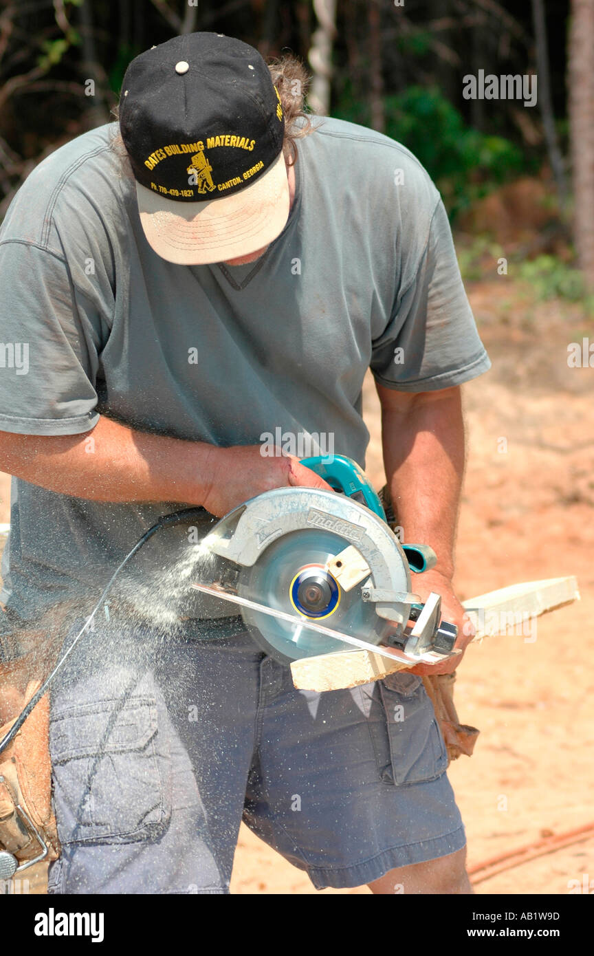 unsafe cutting wood frame home construction by workers stick built work ...