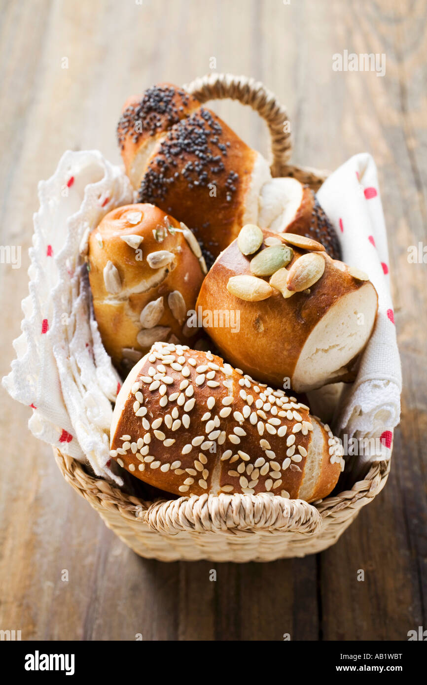Assorted pretzel rolls or lye rolls in bread basket FoodCollection ...