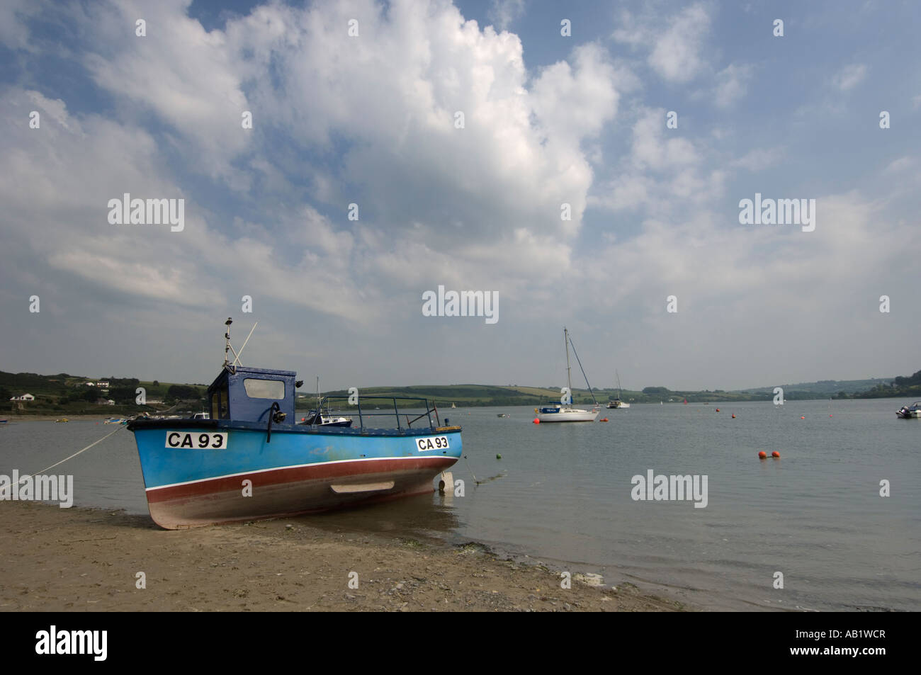 fishing boat at low tide at Gwbert Teifi Estuary 3 miles down river ...