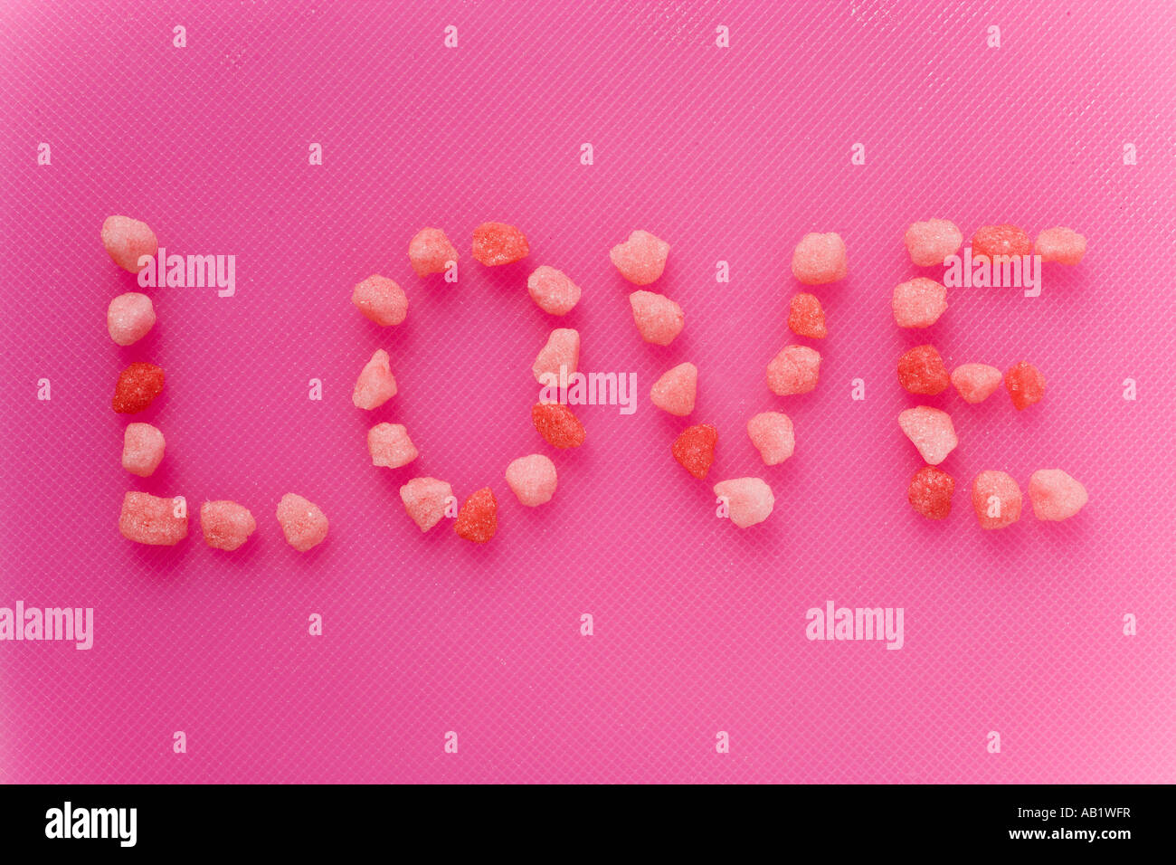 The word Love written in small pink sweets FoodCollection Stock Photo ...