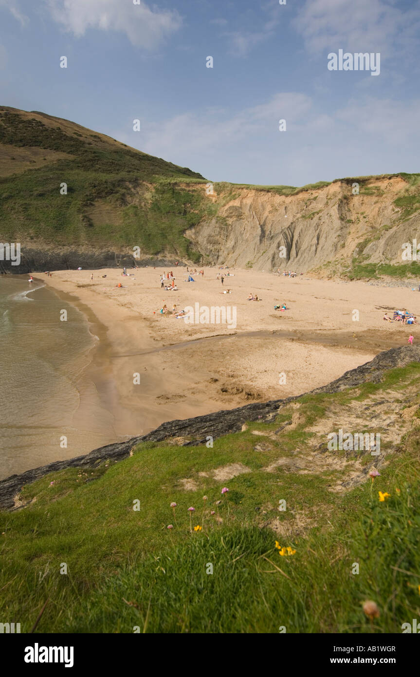 The sandy beach in the cove at Mwnt Bay west of Cardigan Wales UK, a ...