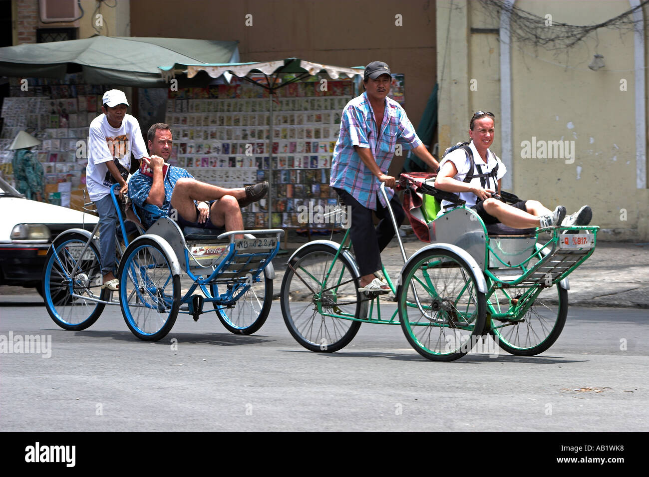 Visitors tour Ho Chi Minh City by cyclo rickshaw Vietnam Stock Photo ...