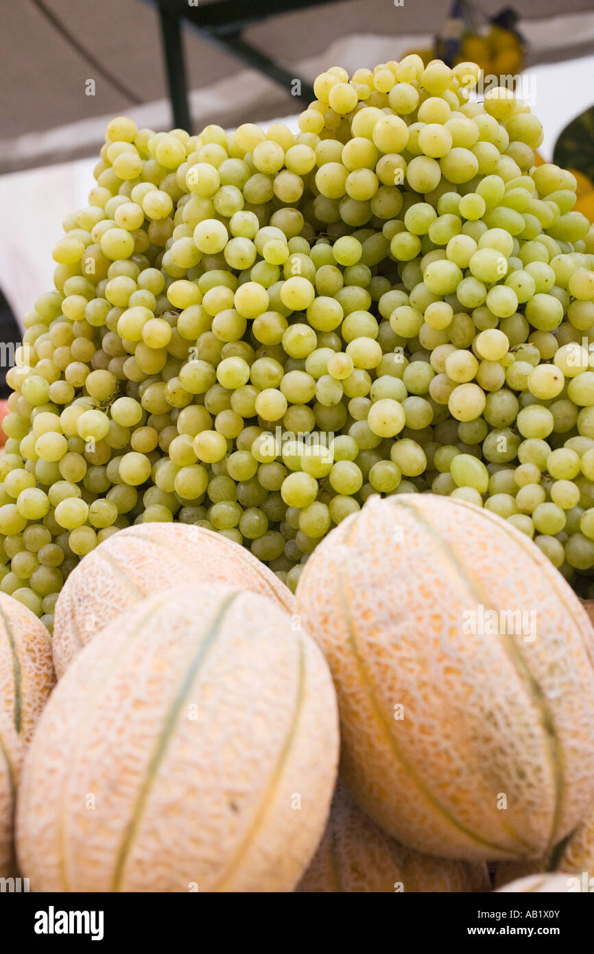 Green grapes and melons at a market FoodCollection Stock Photo - Alamy