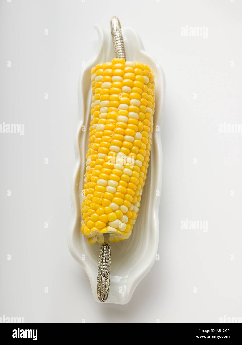 Corn cob in white dish FoodCollection Stock Photo - Alamy