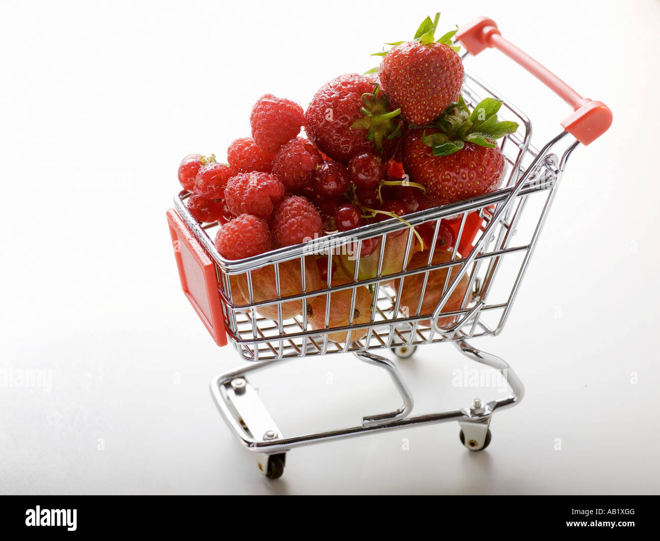 Assorted berries in toy shopping trolley FoodCollection Stock Photo - Alamy