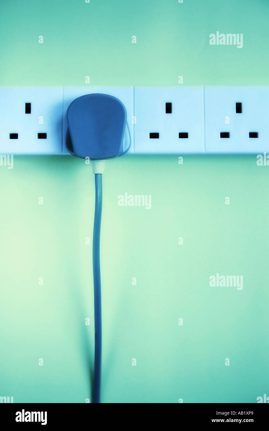 a plug in a socket Stock Photo - Alamy