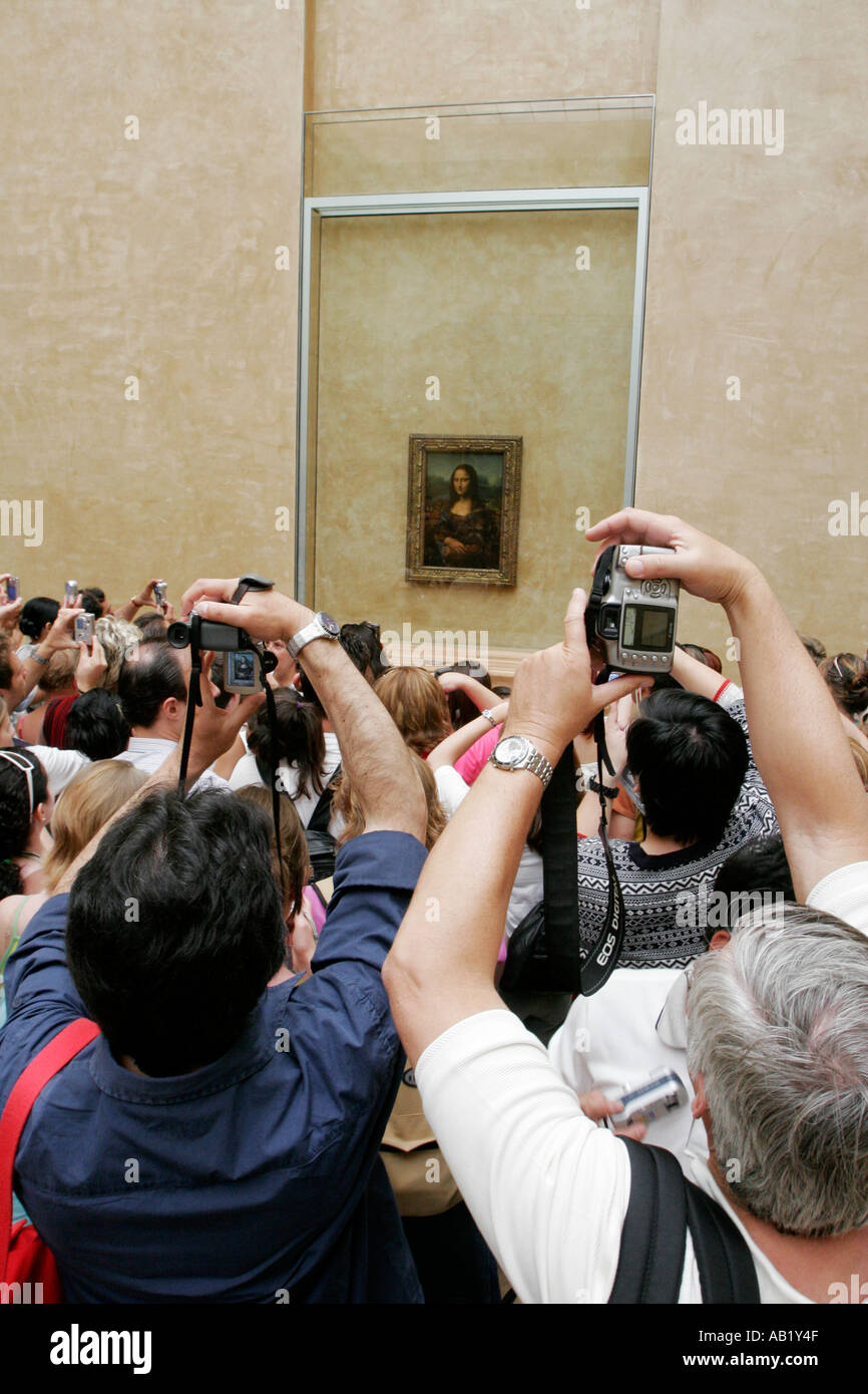 Tourist talking photos of the Mona Lisa in the Grand Louvre Paris ...