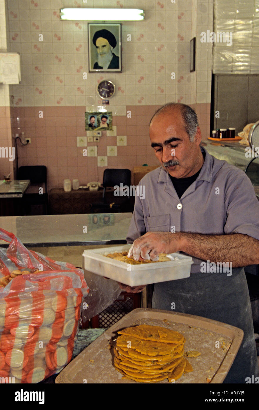 Traditional baker preparing biscuits in bakery, Qom, Iran, Middle East ...