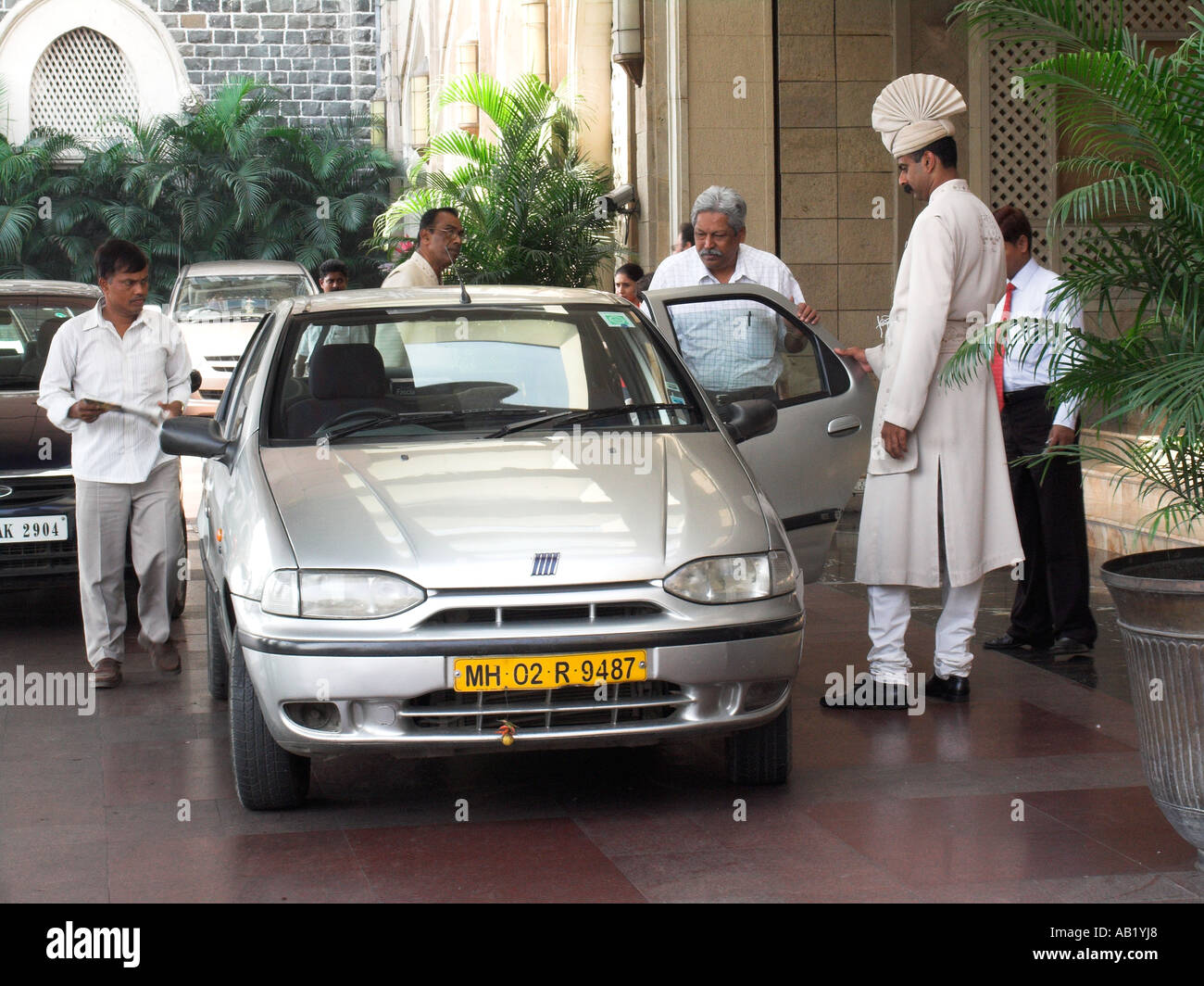 Uniformed doorman Taj Mahal Palace and Tower or Taj Mahal Hotel on ...