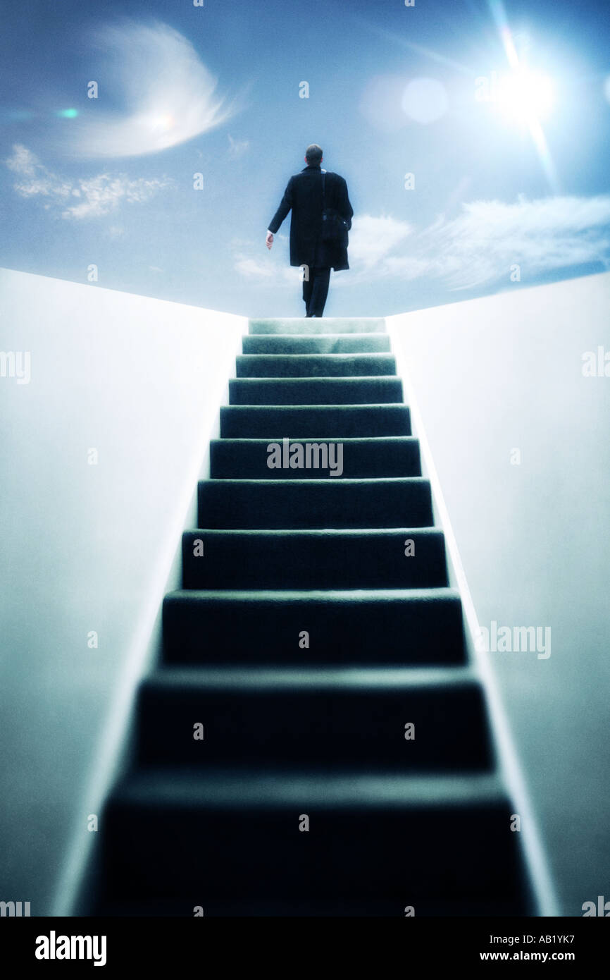 a man walking up steps to the top Stock Photo - Alamy