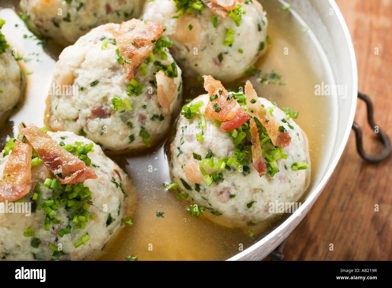 Clear broth with bacon dumplings detail FoodCollection Stock Photo - Alamy