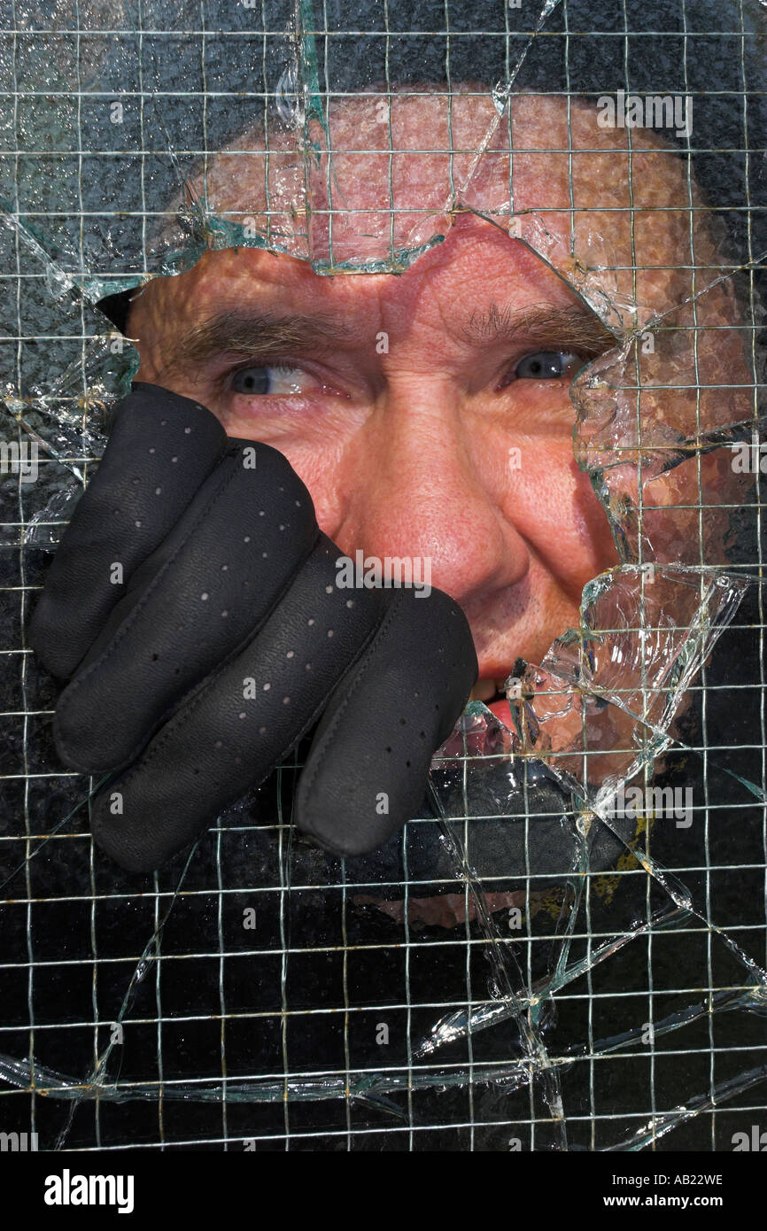 Man smashing window hi-res stock photography and images - Alamy