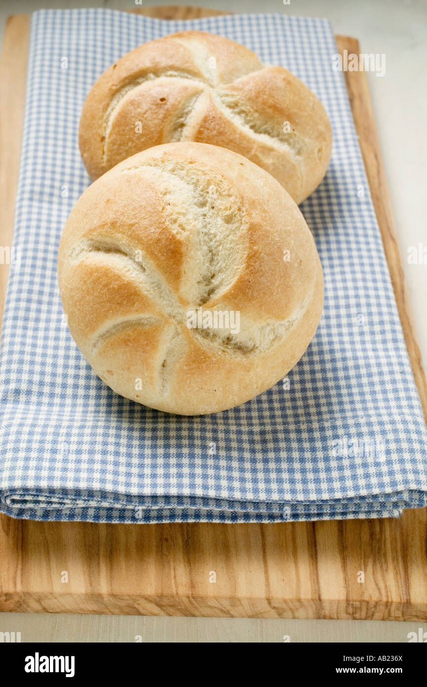 Two bread rolls on blue and white checked cloth FoodCollection Stock ...