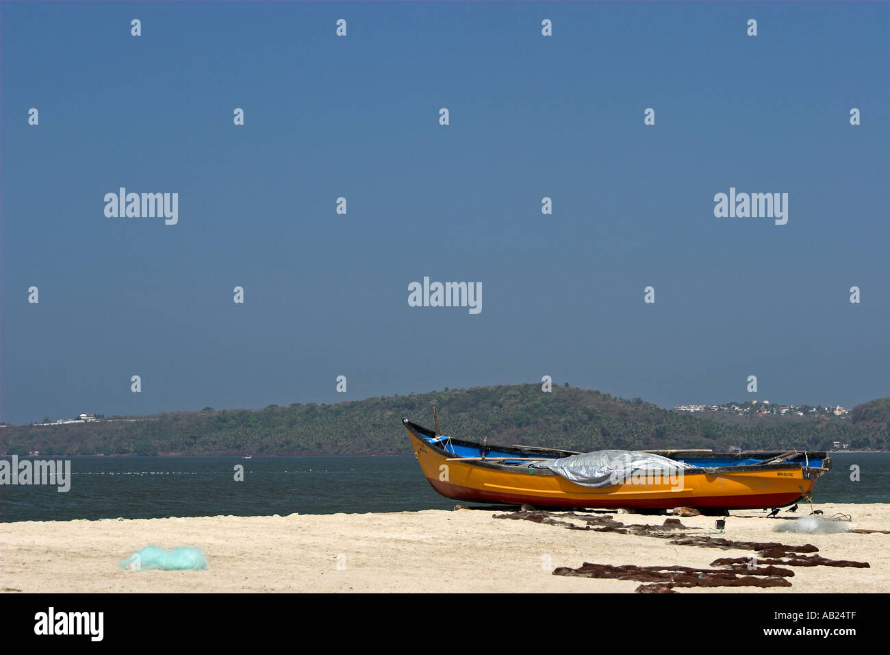 Open yellow boat on quiet Velsao Beach near Dabolim Airport Goa India ...