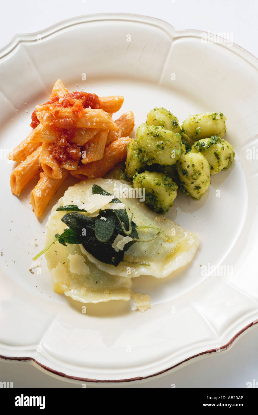 Three pasta dishes on one plate FoodCollection Stock Photo - Alamy