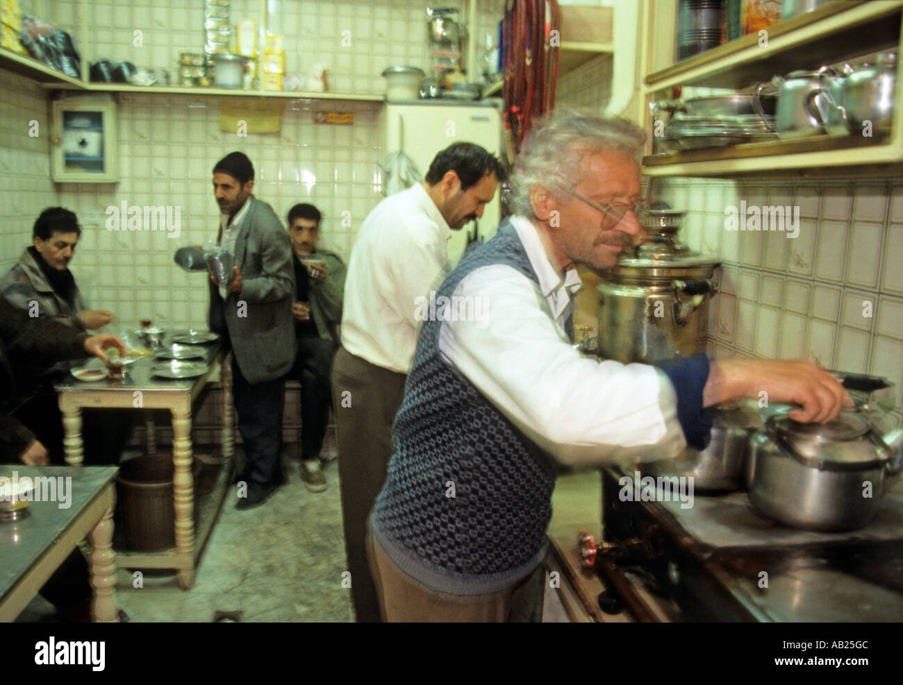 Team of men brewing tea in tea house kitchen, Tehran, Iran, Middle East ...