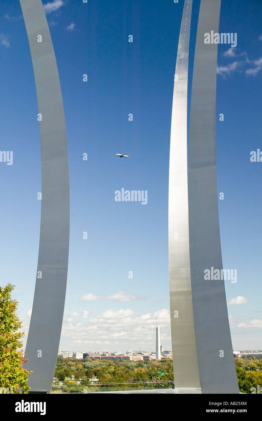 Commercial jet flies over Air Force Memorial with three soaring spires ...