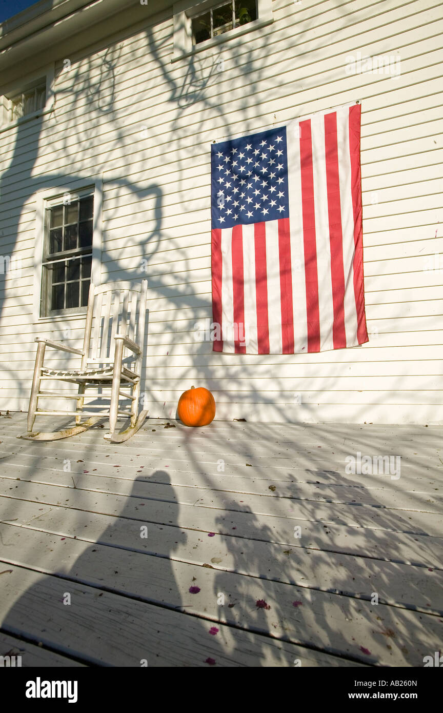 American flag pumpkin and rocking chair on porch of home in Newport ...