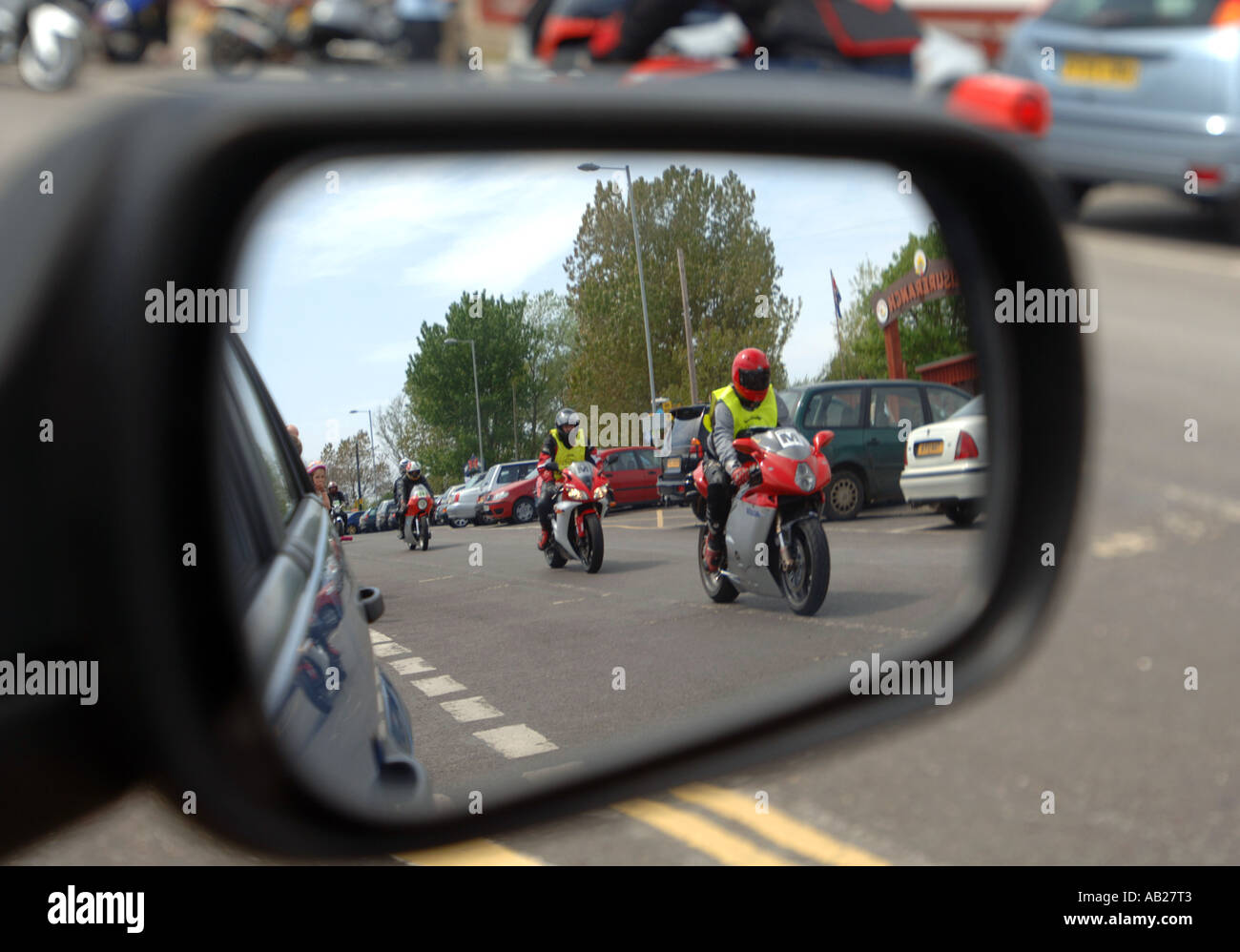 Motorcycles overtaking as seen in car rearview mirror Stock Photo - Alamy