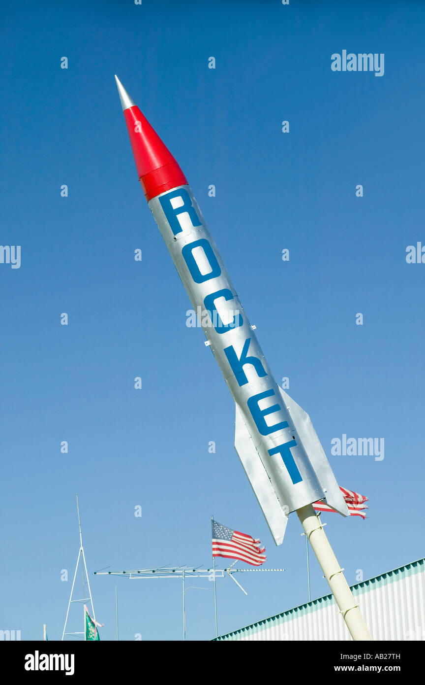 Roadside rocket and American flag in Alamogordo southern New Mexico off ...
