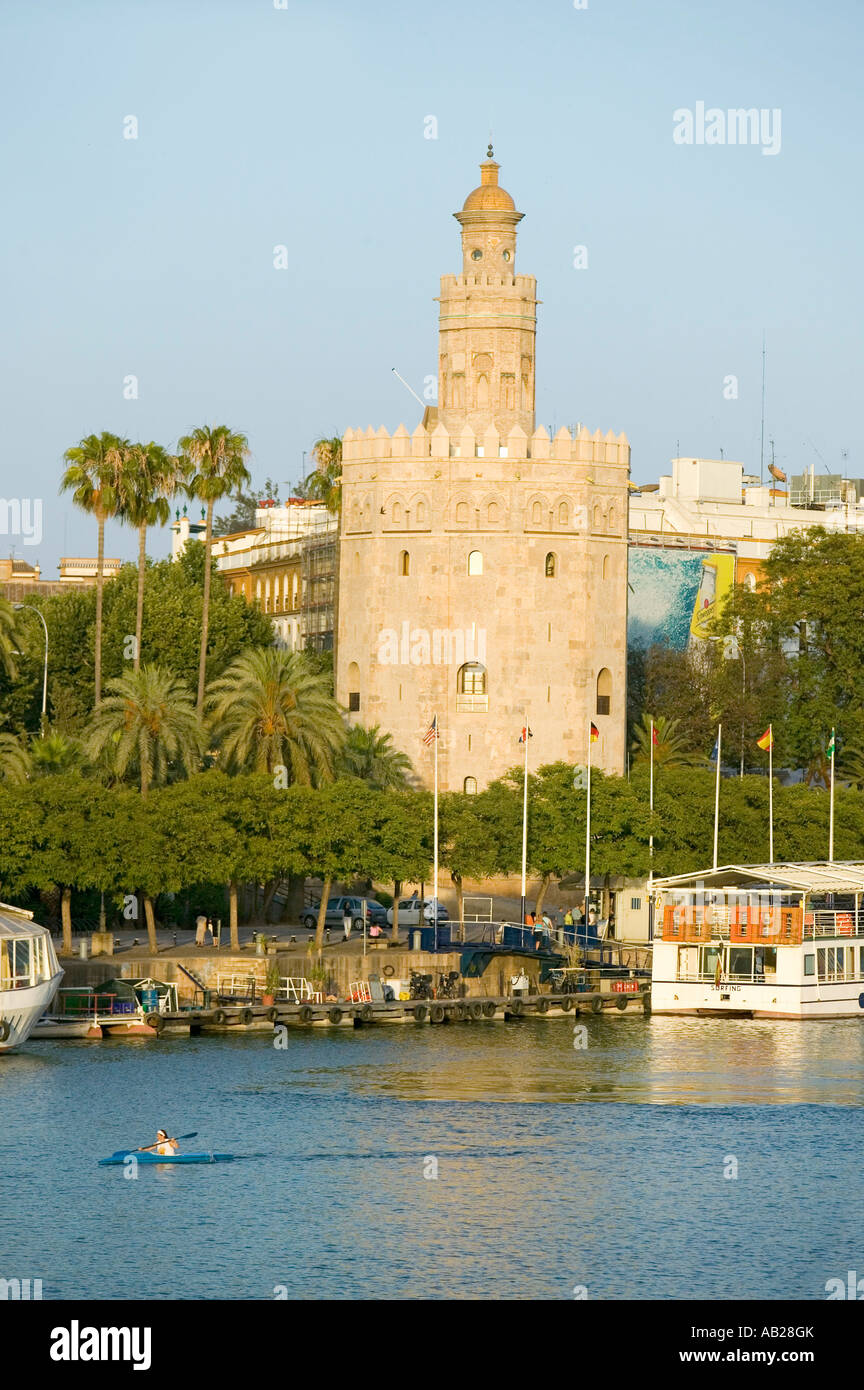 View of the octagonal tower of Torre del Oro makes golden reflection on ...