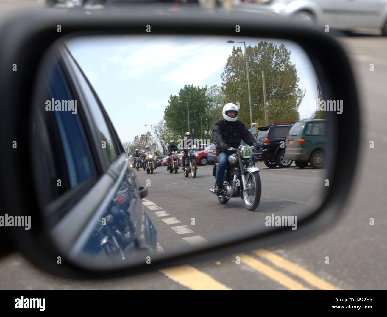 Motorcycles overtaking as seen in car rearview mirror Stock Photo - Alamy