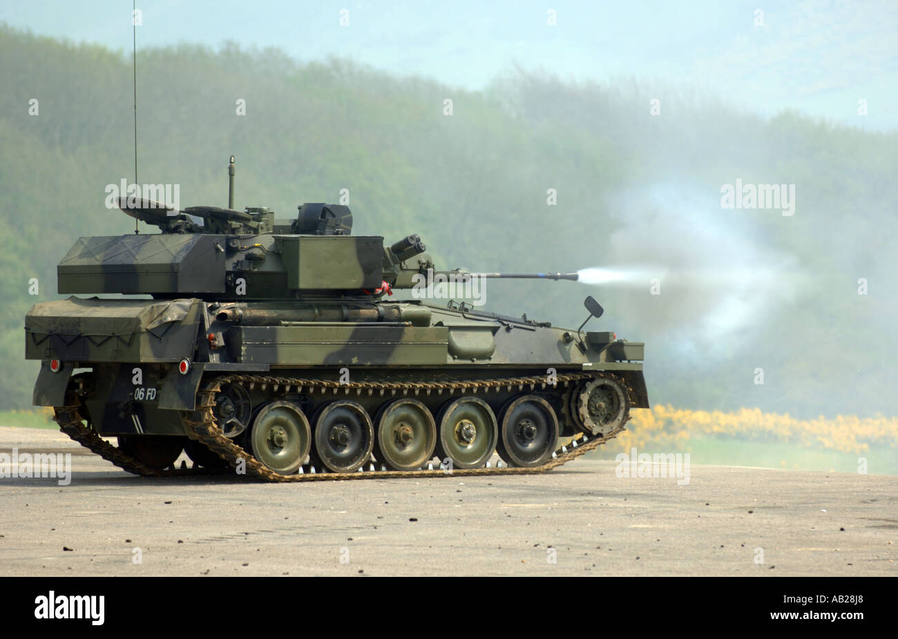 Scimitar tank firing its gun during tank training at "The Armour Centre ...