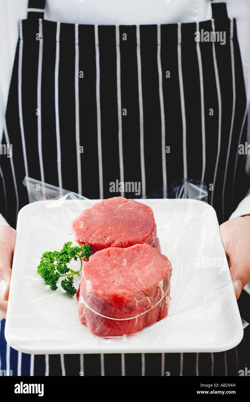 Two slices of beef fillet tied with string FoodCollection Stock Photo ...