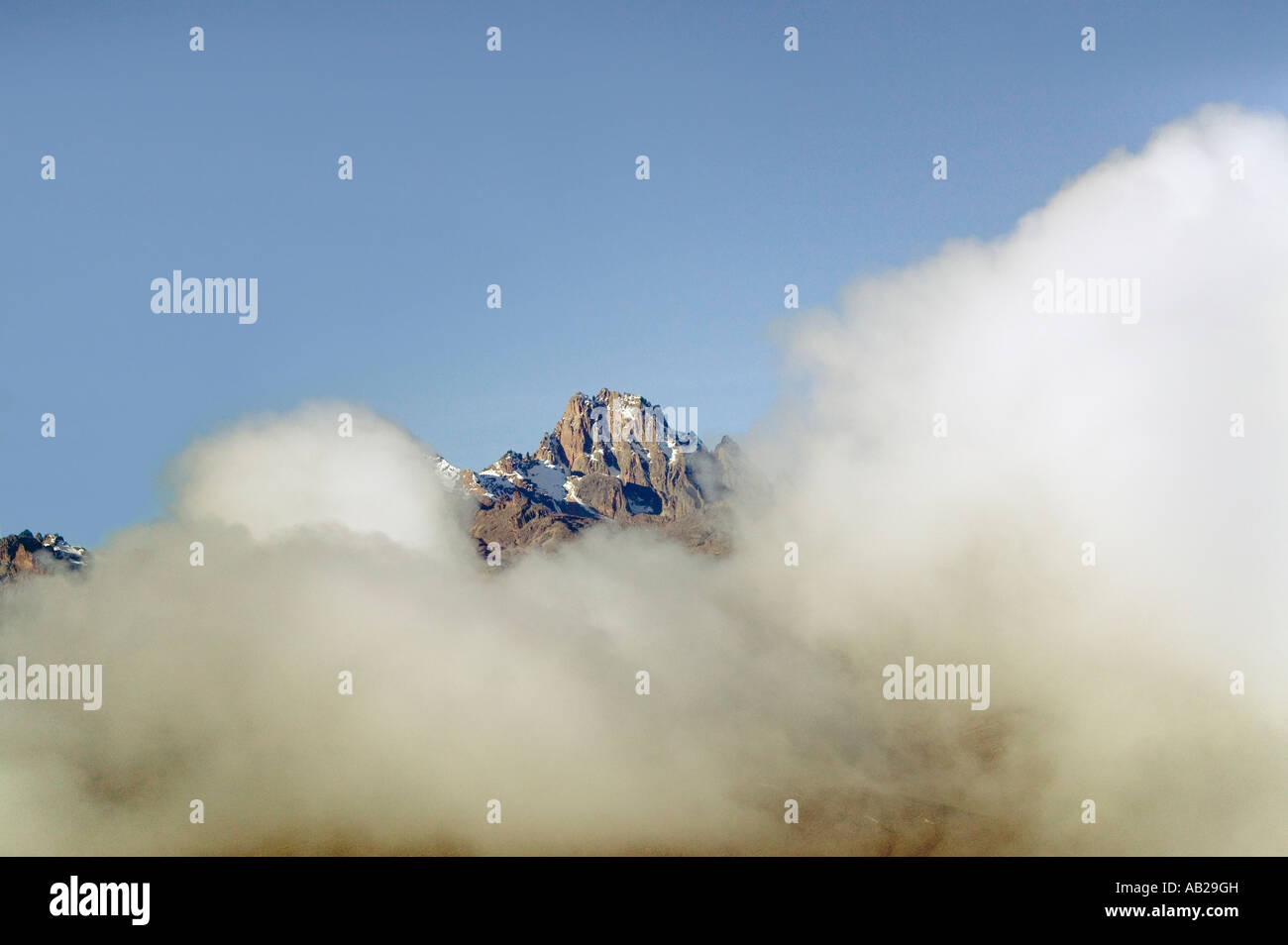 Aerial of Mount Kenya Africa with snow and white puffy clouds in ...