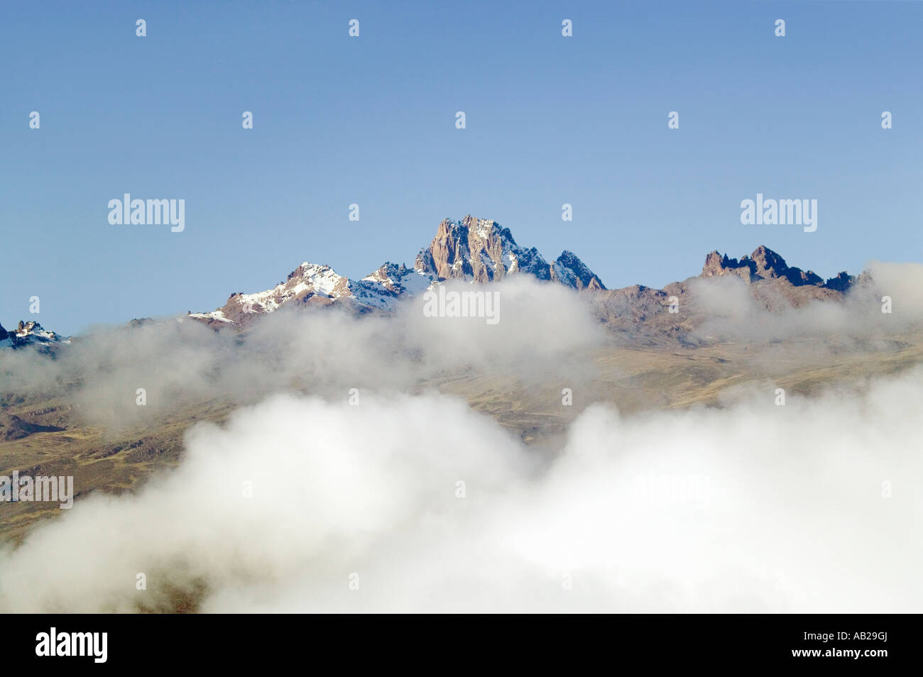 Aerial of Mount Kenya Africa with snow and white puffy clouds in ...