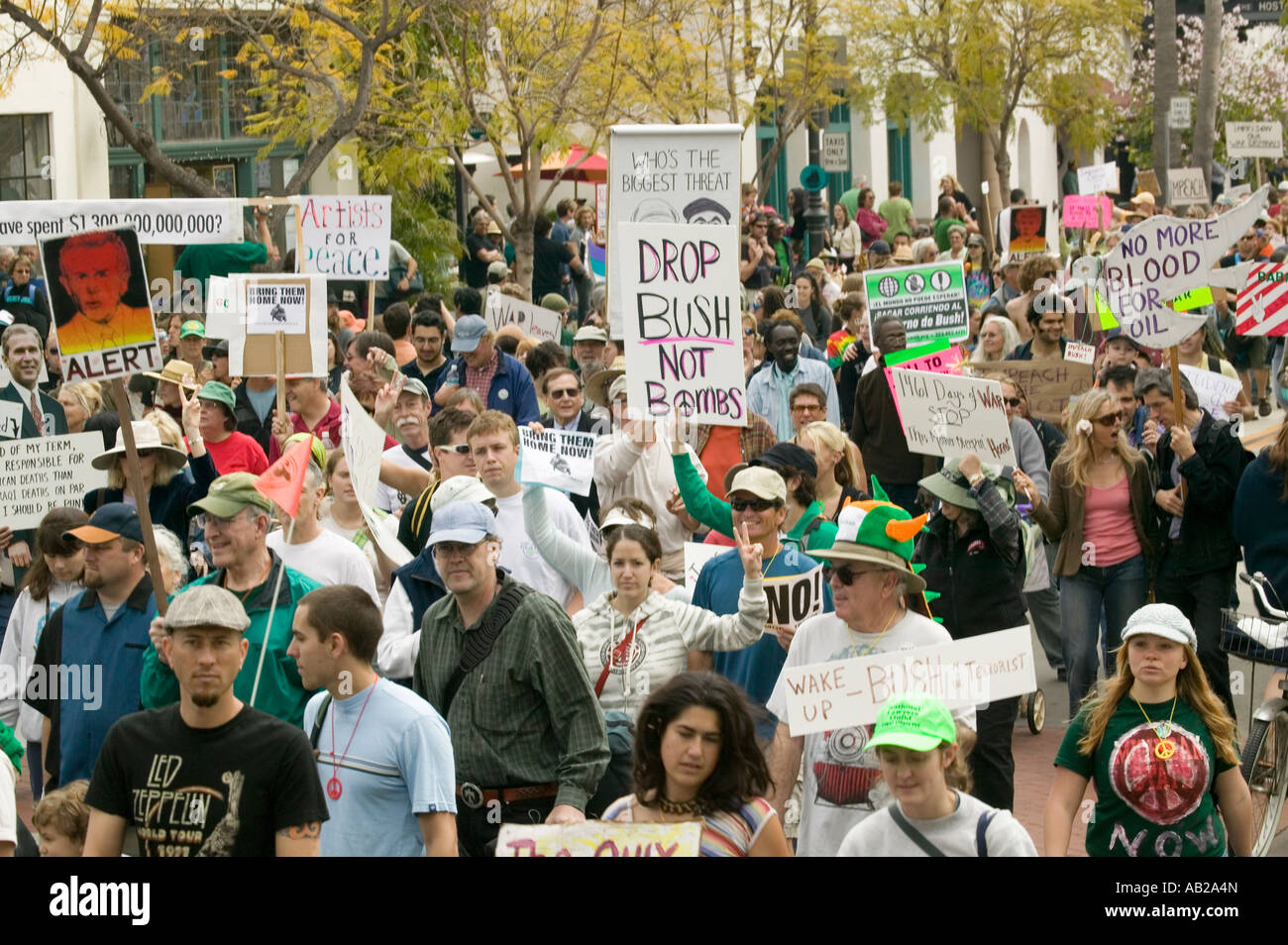 A large crowd of protesters march and chant down State Street carrying ...