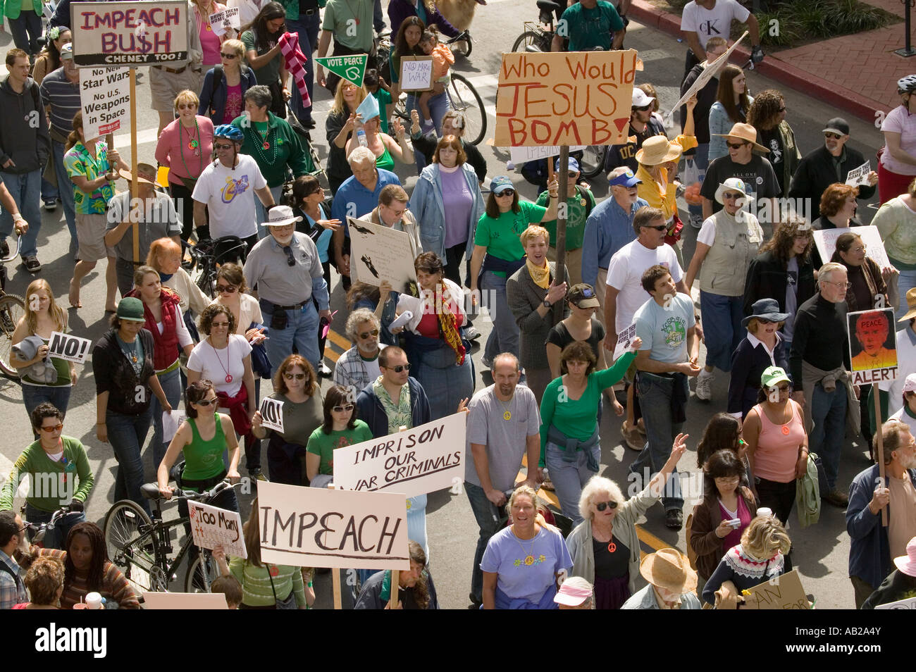 A large crowd of protesters march and chant down State Street carrying ...
