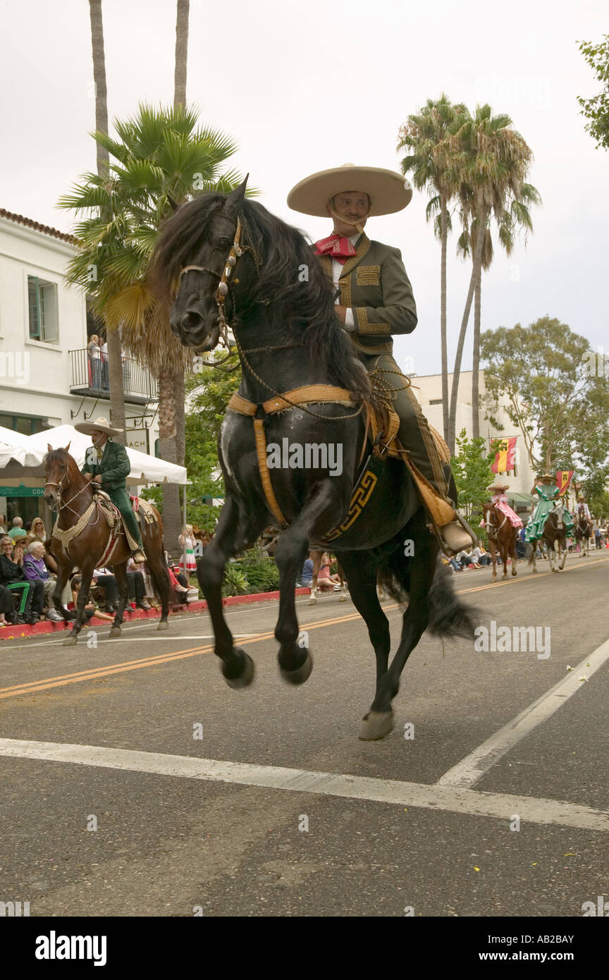Mexican horseback riders trot along during the opening day parade down ...